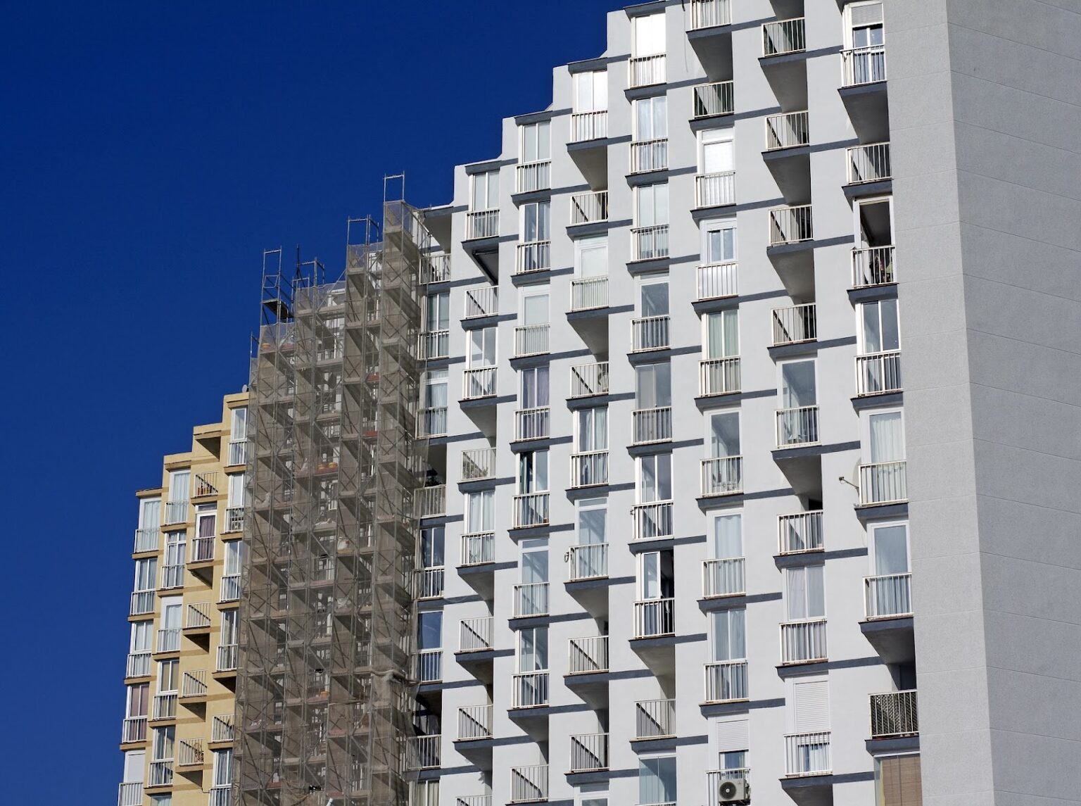 The Whys and Hows of Repainting Your Commercial Building - Go Beyond Bounds